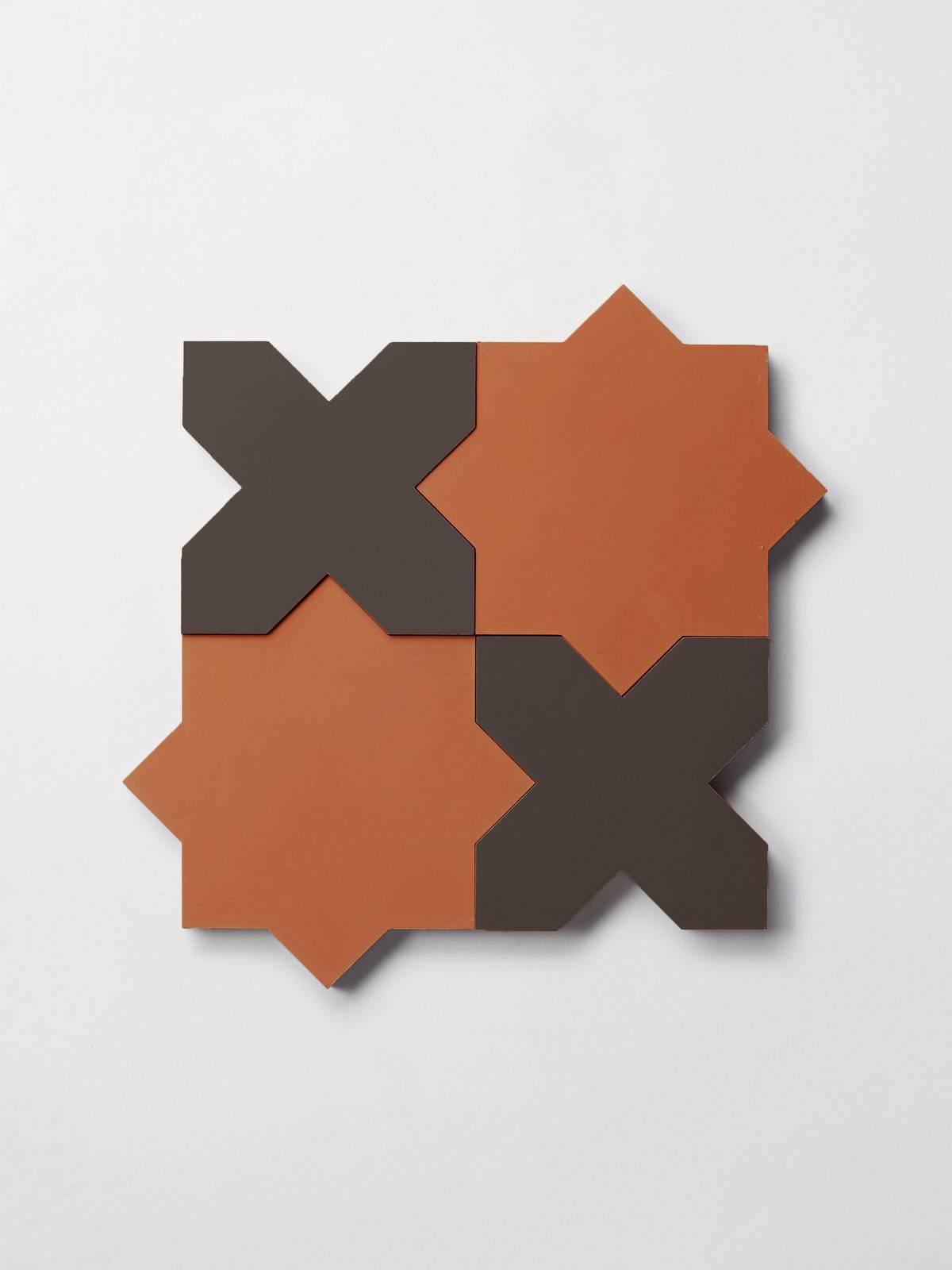 clé | cement | pavimenti | flowerpot star + charcoal cross – clé tile